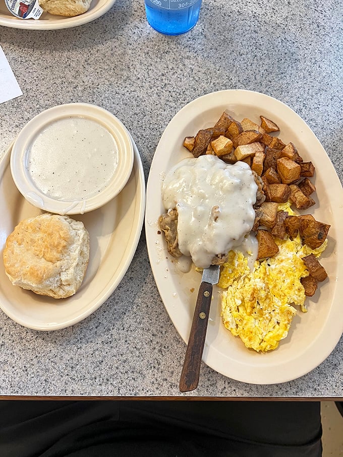 Biscuits and gravy: the cornerstone of American breakfast architecture. That knife isn't just a utensil&mdash;it's the key to unlocking pure comfort.