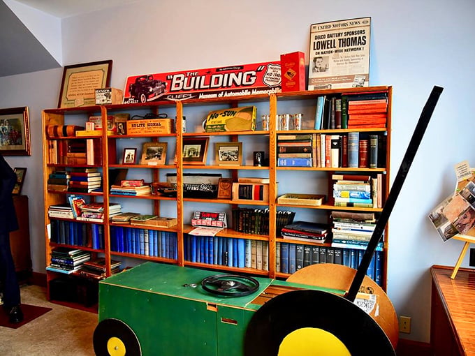 Automotive literature fills these shelves like a library of mechanical dreams, each manual and book preserving knowledge that might otherwise be lost.