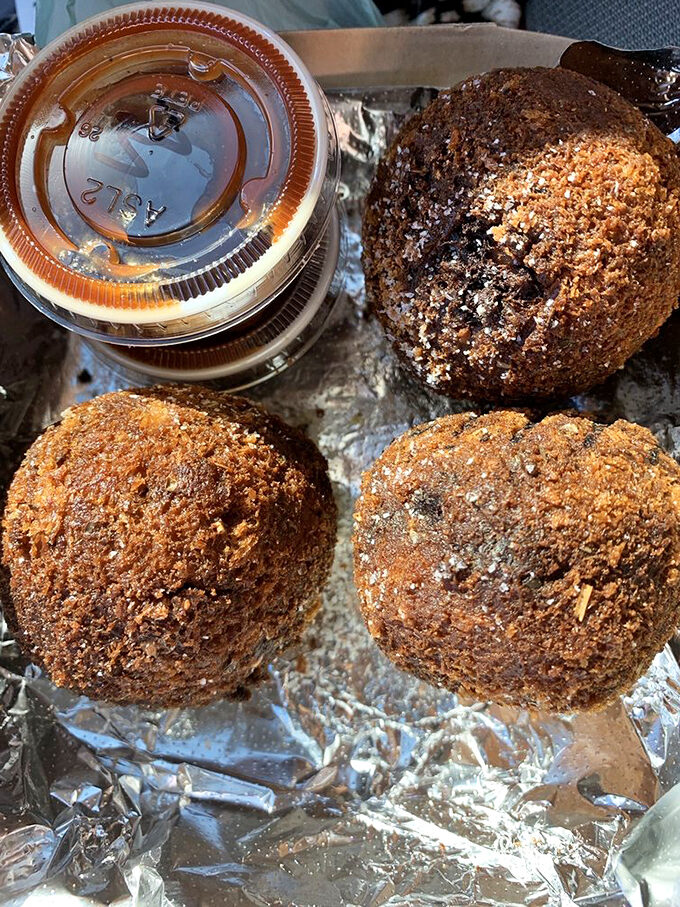 These golden-brown spheres aren't just appetizers; they're crispy vessels of smoky goodness that disappear faster than your willpower.