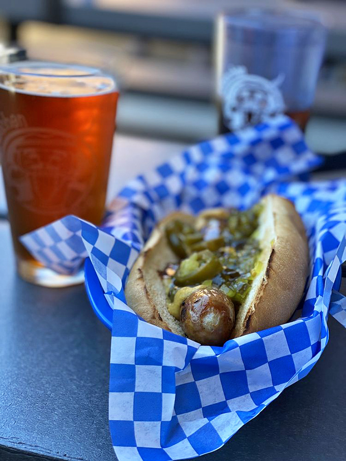 This isn't just a hot dog&mdash;it's a sausage with ambition, nestled in a fresh bun and dressed with enough toppings to make it blush. 