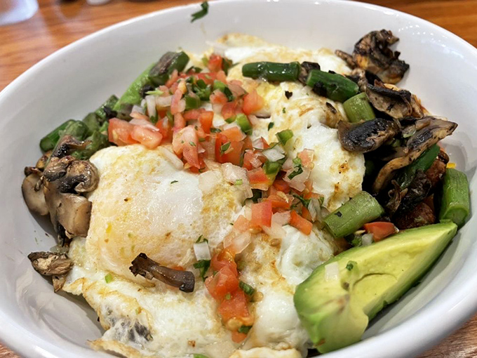 A breakfast bowl that's basically a morning treasure chest—eggs, veggies, and avocado creating a nutritional jackpot worth waking up for.