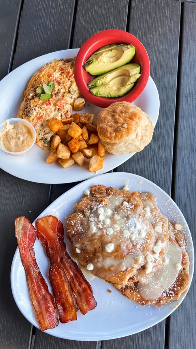 Breakfast harmony achieved: fluffy pancakes, crispy bacon, and a perfect omelet sharing a plate like the supergroup your taste buds have been waiting for.