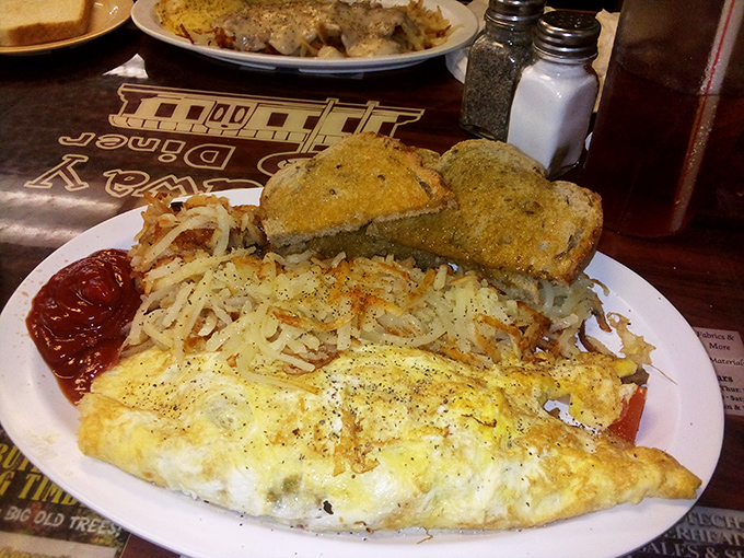 Hash browns so perfectly crispy they deserve their own fan club, paired with eggs that clearly graduated from the School of Perfect Execution.