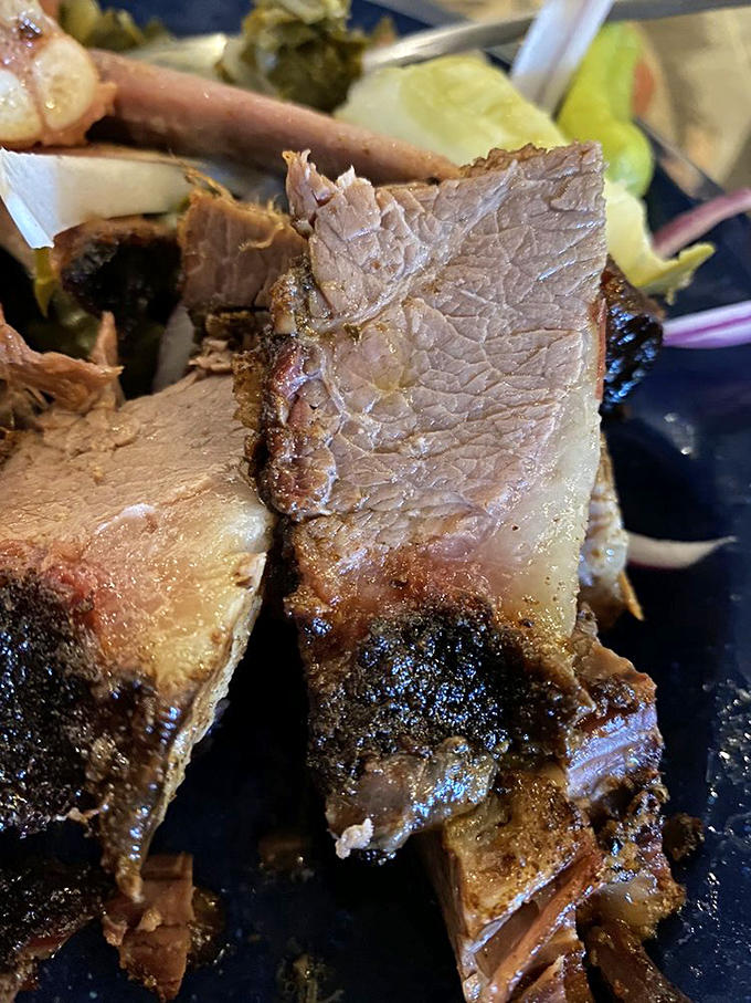 Brisket so tender it practically surrenders at the sight of your fork. That bark contains more flavor than some five-course meals.