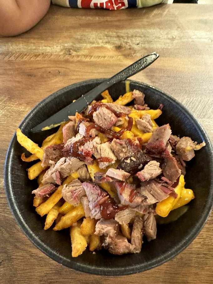 Brisket-loaded fries&mdash;where comfort food meets BBQ in a glorious caloric conspiracy that makes you forget you ever knew the word "diet."