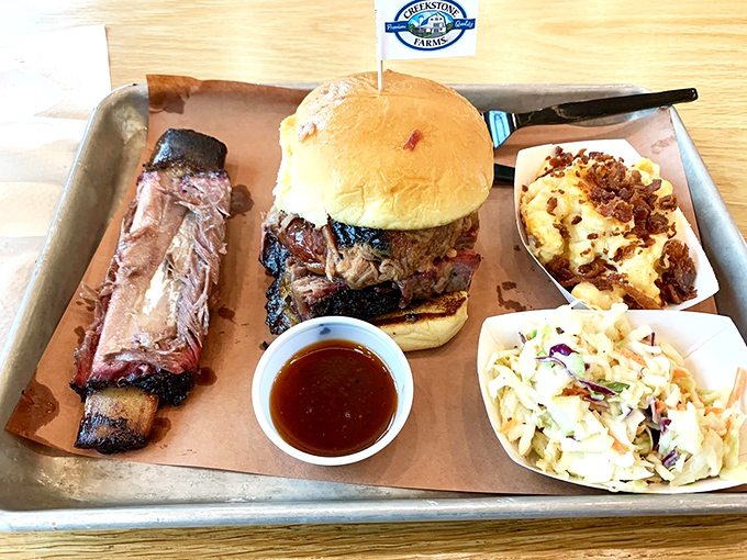 This isn't just a sandwich&mdash;it's an architectural achievement. Load-bearing bun supports a skyscraper of smoked goodness that's worth every messy bite.