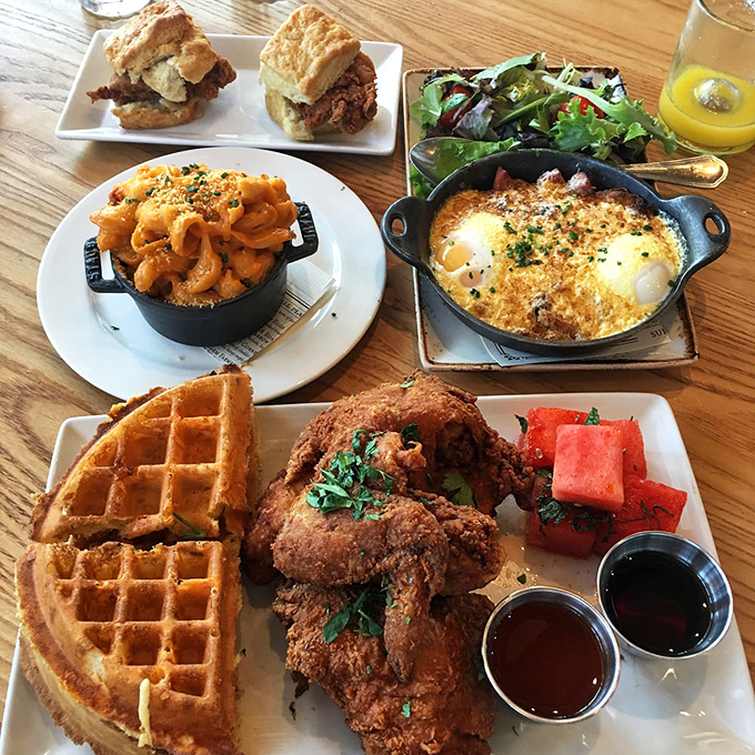 Brunch nirvana achieved! Mac and cheese, chicken and waffles, and what appears to be eggs in cast iron—the breakfast trifecta.