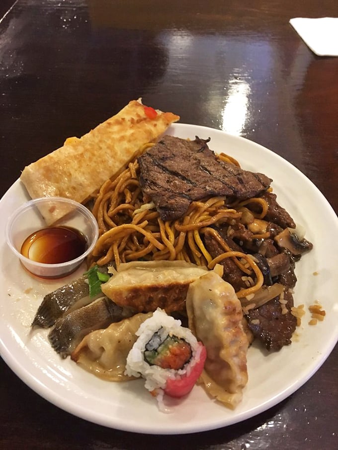 A plate that tells the story of international harmony &ndash; lo mein, dumplings, steak and sushi living in delicious coexistence. United Nations, take notes.