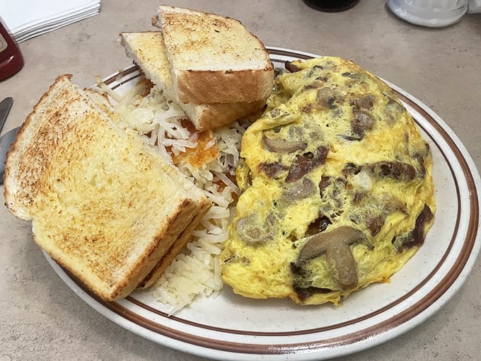 An omelet so perfectly executed it deserves its own slow-motion entrance music. Those mushrooms didn't just show up&mdash;they were invited to the party.