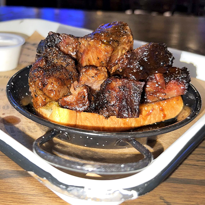 Ribs with a bark so perfect, they should be in a barbecue museum. The smoke ring is practically a halo.