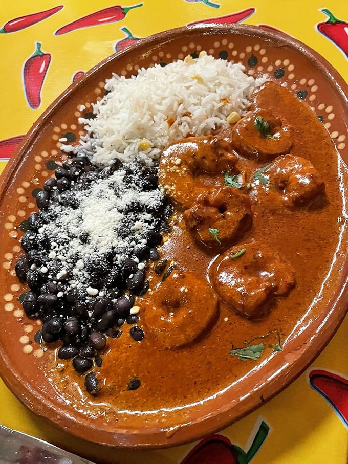 A symphony of shrimp in chipotle sauce alongside perfect rice and beans. This plate doesn't just feed you&mdash;it serenades your taste buds with smoky, spicy notes.