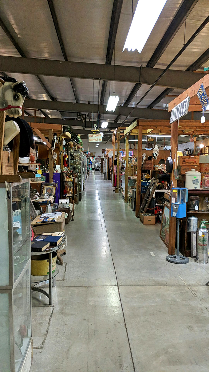 Long aisles of vendor stalls beckon explorers deeper into the labyrinth. That rocking horse on the left has stories to tell.