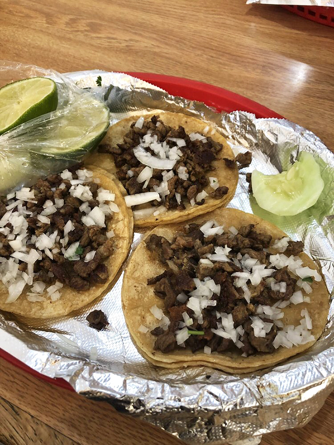 Al pastor tacos with that signature orange-hued marinade&mdash;the color that signals to taco aficionados that happiness is just one bite away.