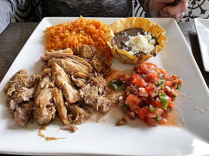 Carnitas that don't need fancy plating to impress&mdash;just tender meat, vibrant pico, and the knowledge that someone in that kitchen really cares.