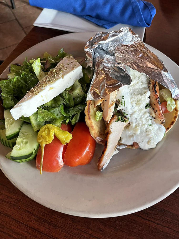 The chicken gyro with Greek salad &ndash; proof that healthy choices don't require taste sacrifices. This plate has more Mediterranean vibes than my last vacation.
