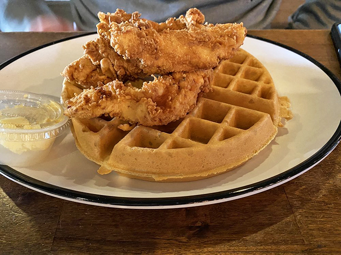 Southern comfort meets Midwest hospitality &ndash; crispy fried chicken perched atop a golden waffle, waiting for that first magical bite of sweet-savory perfection.