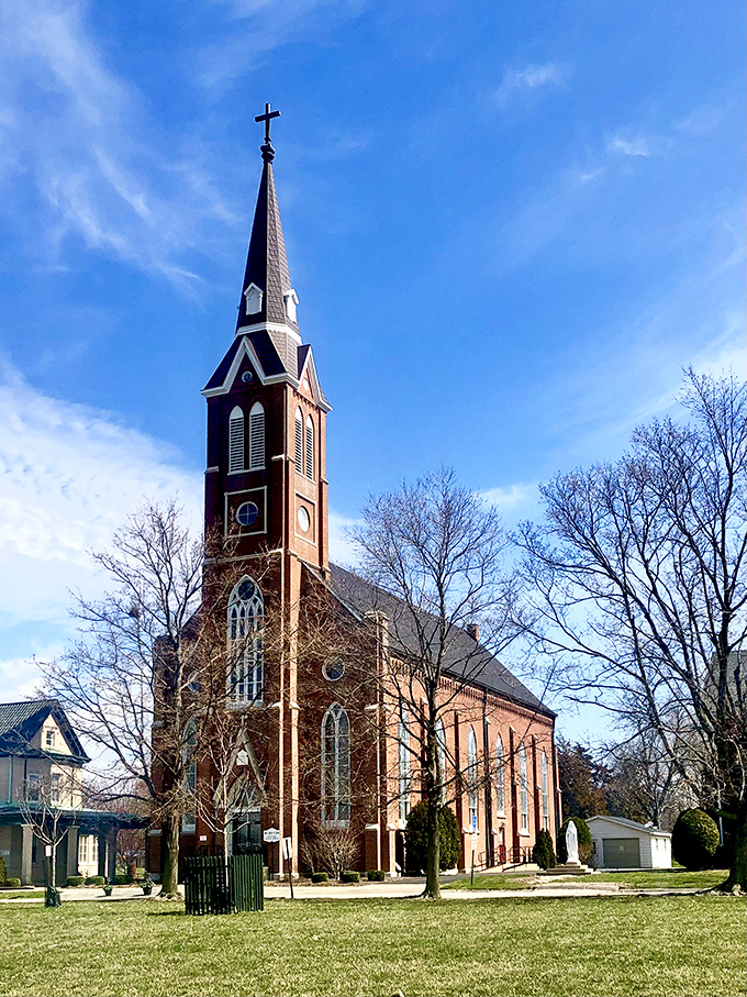 This striking brick church reaches skyward with its impressive spire, standing as a testament to the town's deep religious roots.