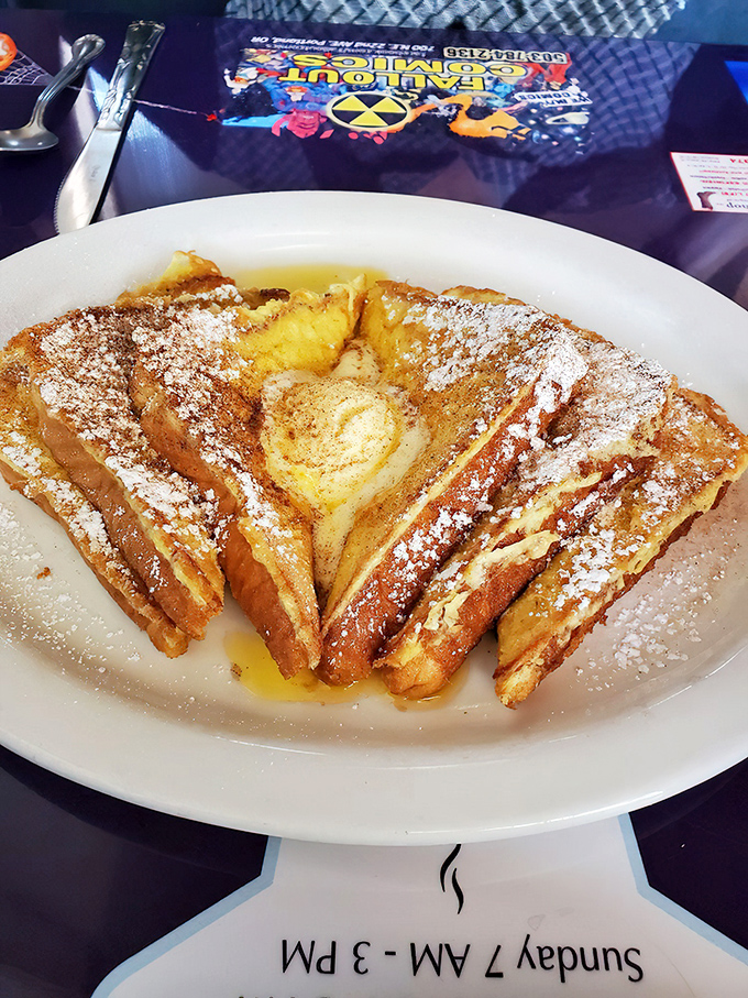 French toast that makes you question why anyone bothers with fancy brunch. Golden, cinnamon-kissed triangles arranged like they're posing for their yearbook photo.
