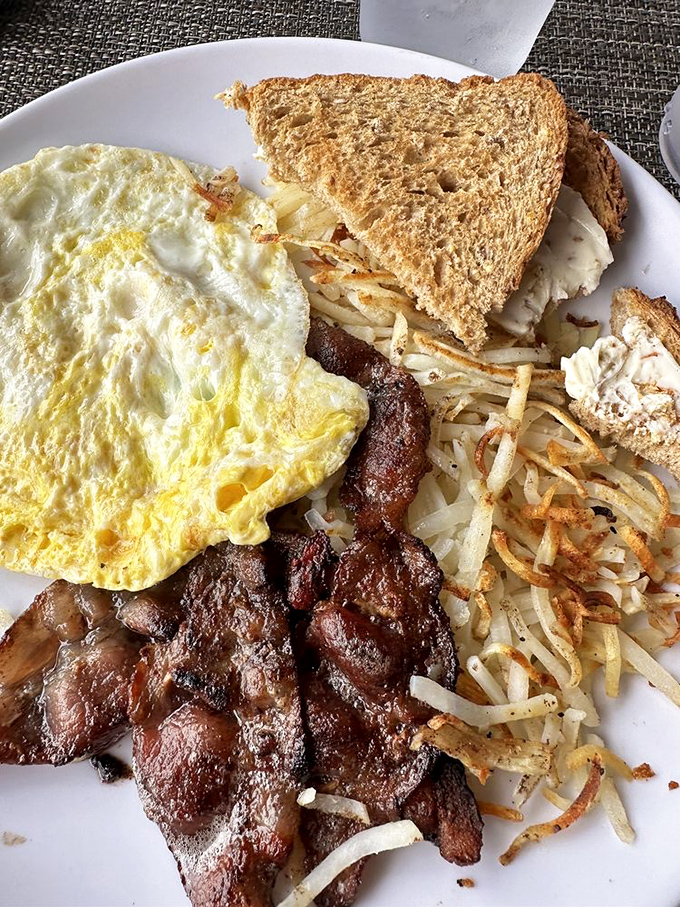 The classic breakfast done right&mdash;eggs, hash browns, and meat in perfect proportion. Simplicity isn't boring when it's executed with this much care.