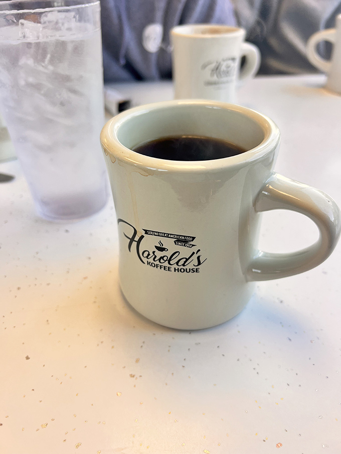 That sturdy white mug isn't just holding coffee &ndash; it's cradling liquid motivation that's fueled this community for decades.