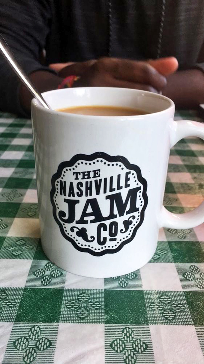 The coffee mug says Nashville Jam Co., but what it really means is "hold on tight, you're about to have a religious experience with breakfast."