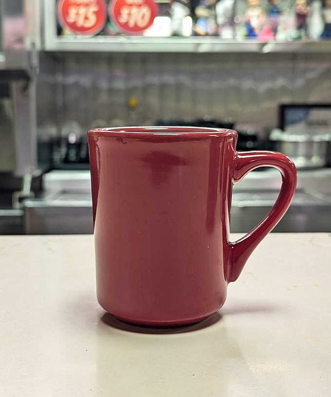 That red coffee mug holds liquid motivation strong enough to fuel a Minnesota winter morning.