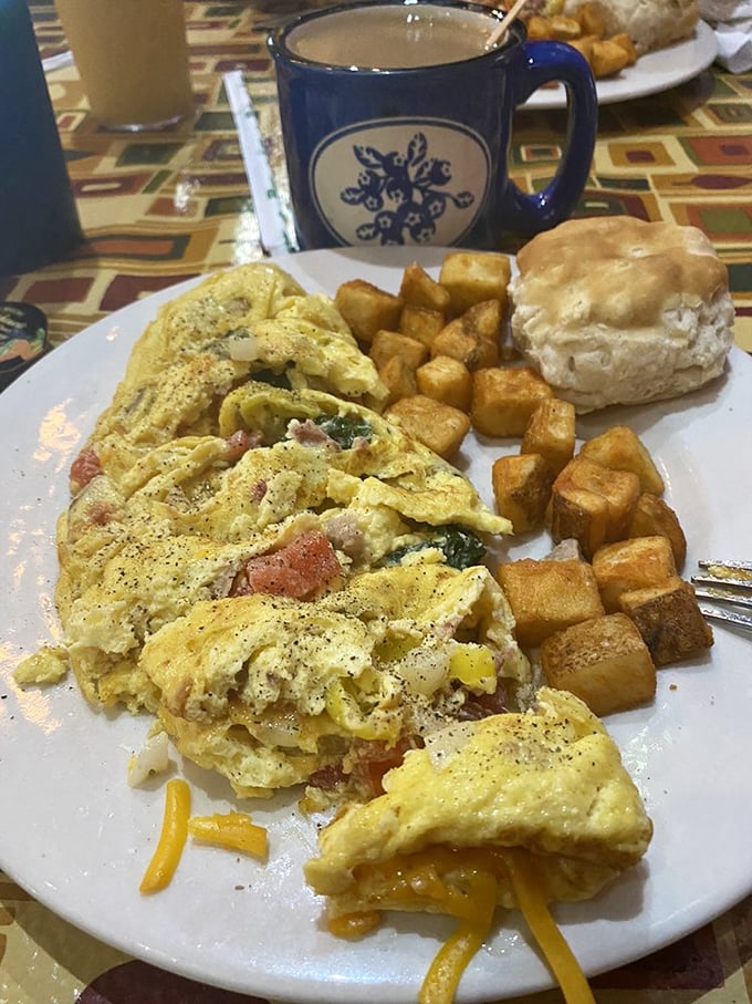 That blue coffee mug isn't just holding caffeine&mdash;it's cradling liquid motivation alongside an omelet that means business.