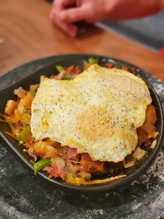 A skillet loaded with potatoes, peppers, and eggs that tells the story of breakfast in its most honest and delicious form.