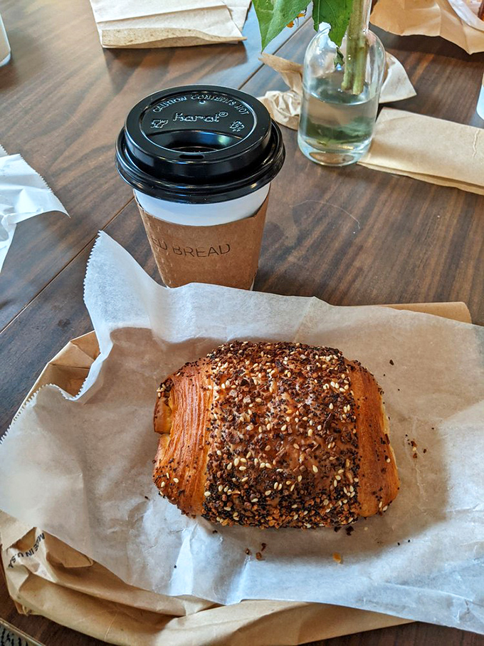 The quintessential breakfast of champions: artisanal caffeine meets handcrafted pastry. Some people meditate; others have this exact moment.