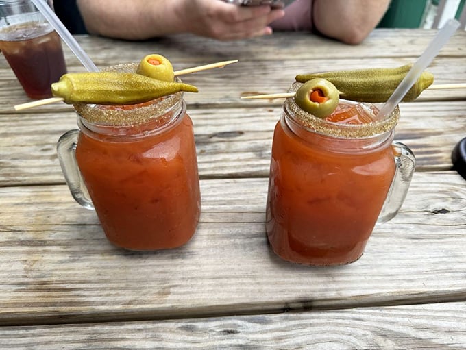 These Bloody Marys aren't just drinks, they're liquid appetizers. The pickle garnish is practically winking at you.