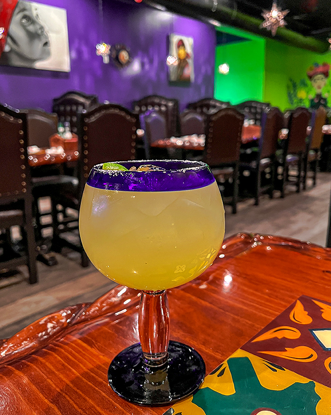 That margarita isn't just a drink, it's a vacation in a glass &ndash; sunshine yellow with a purple rim that's as photogenic as it is delicious. 