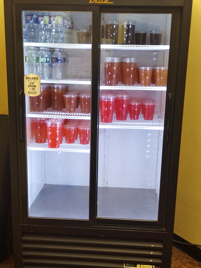 A refrigerator stocked with vibrant fruit punches and sweet teas &ndash; liquid sunshine waiting to wash down all that savory goodness.