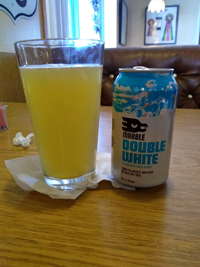 Nothing says "vacation mode" quite like a cold craft beer in a proper glass. Even the can looks pleased with its upgraded accommodations.