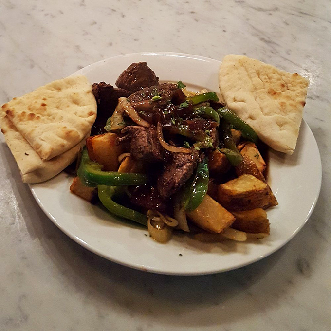 These tender meat tips with vegetables and pita aren't just dinner&mdash;they're edible diplomacy from Greece, no passport required.