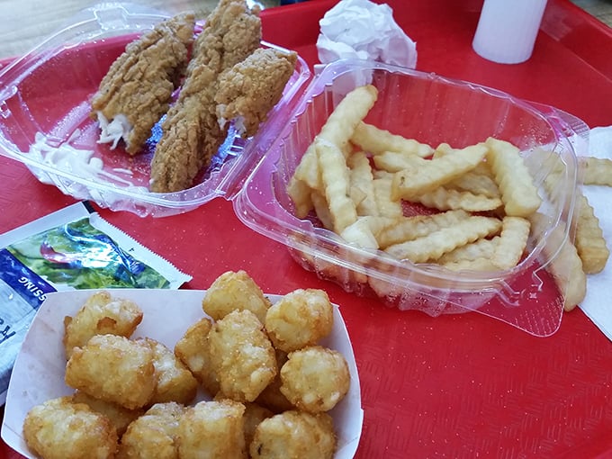 Southern comfort on a red tray&mdash;crispy fish, crinkle-cut fries, and tater tots that make you question why you'd ever need fancy dining.
