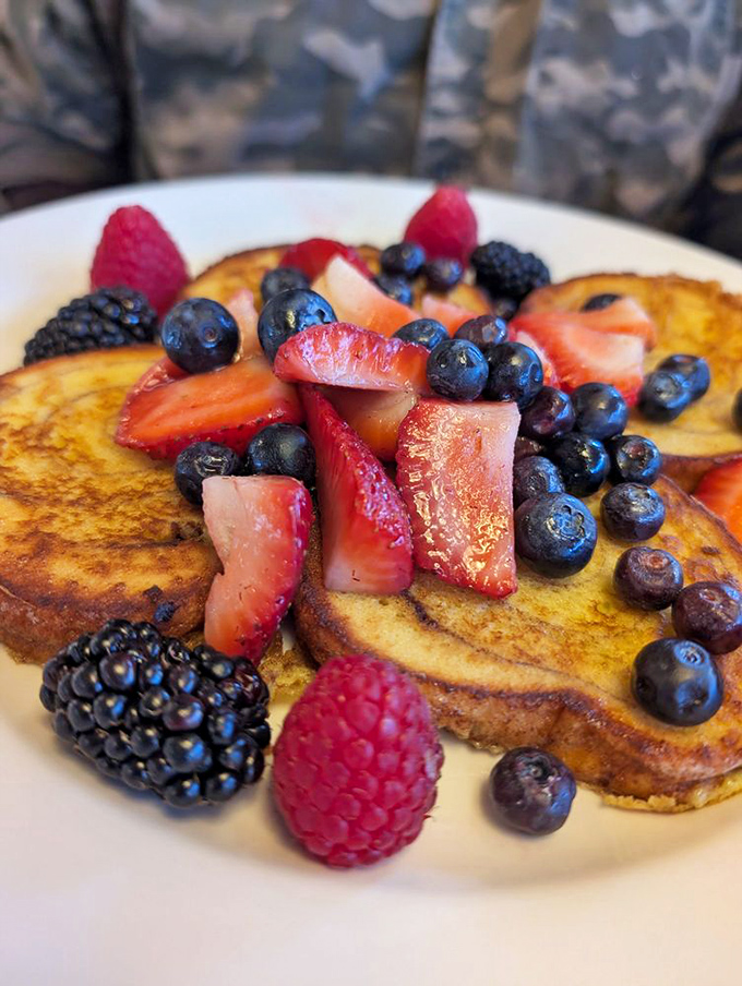French toast that's dressed for success with a berry ensemble. This isn't breakfast &ndash; it's edible jewelry for your taste buds.