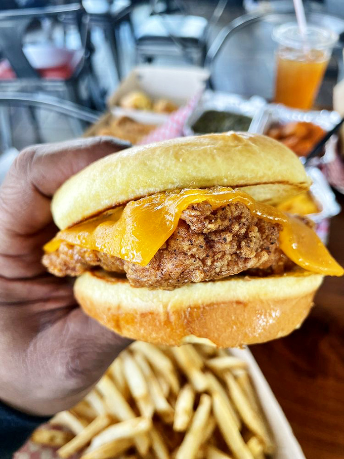 Cheese melting over fried chicken like a warm sunset. This sandwich doesn't just satisfy hunger&mdash;it creates happiness between two buns.