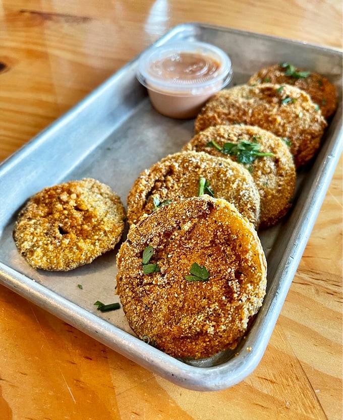 These aren't just fried green tomatoes&mdash;they're Southern diplomats in crispy cornmeal jackets, spreading goodwill and flavor with each golden-brown disk.