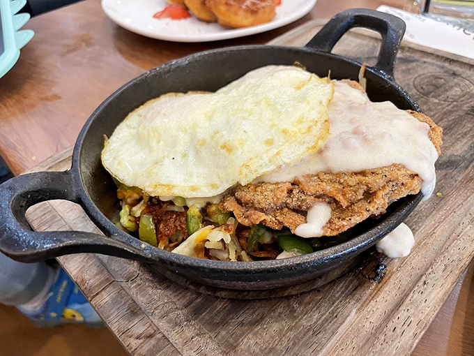 Country fried steak meets eggs in this cast iron masterpiece&mdash;comfort food that gives you a warm hug while simultaneously impressing your taste buds.