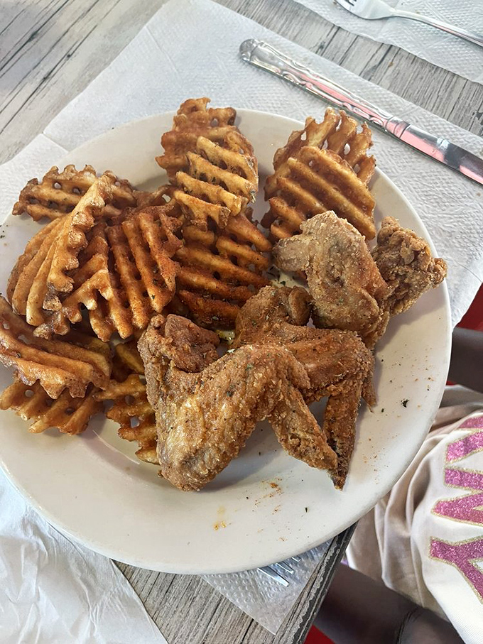 Waffle fries and crispy wings&mdash;proof that some of life's greatest pleasures come from the simplest combinations. No fancy explanation needed.