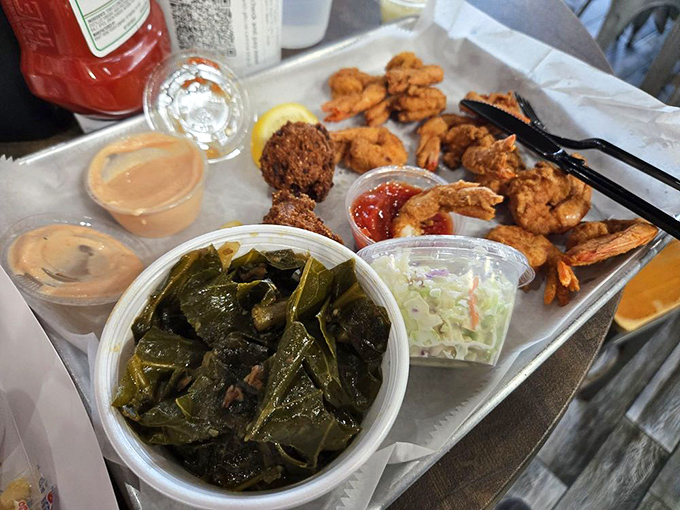 Southern comfort meets coastal bounty: fried shrimp and collard greens. A plate that tells Florida's culinary story better than any cookbook.