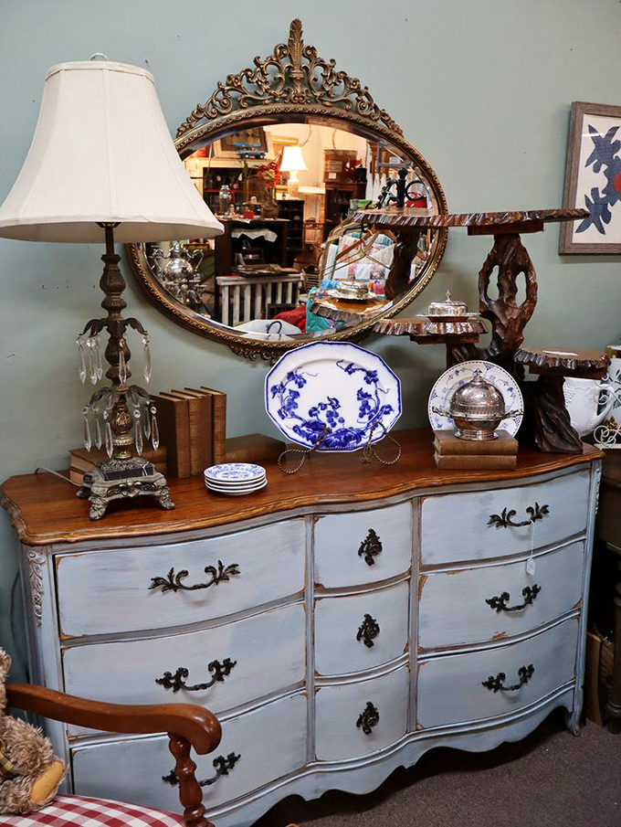 Not your big box store furniture. This elegant dresser with ornate mirror has witnessed more family secrets than a holiday dinner table.