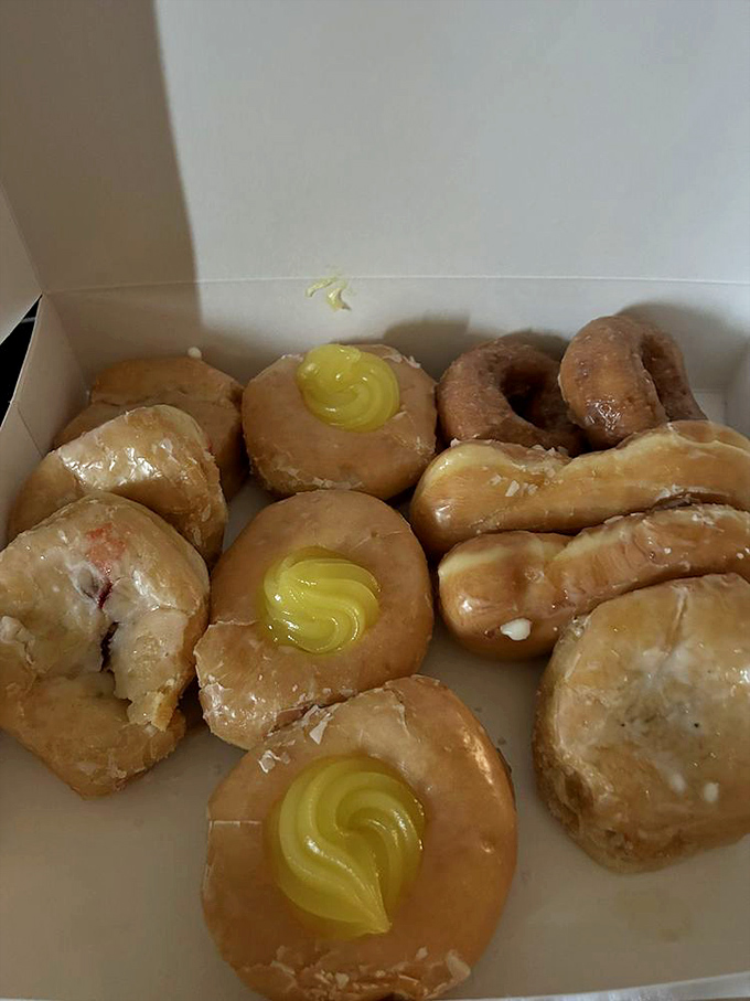 Morning victory comes in many forms, but few are as sweet as this box of perfectly glazed donuts and a chocolate-dipped long john ready for battle.