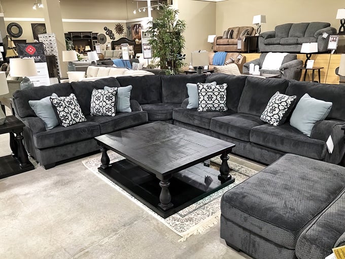 The charcoal sectional creates a cozy conversation pit that practically whispers, "Netflix marathons and takeout were made for this exact spot."