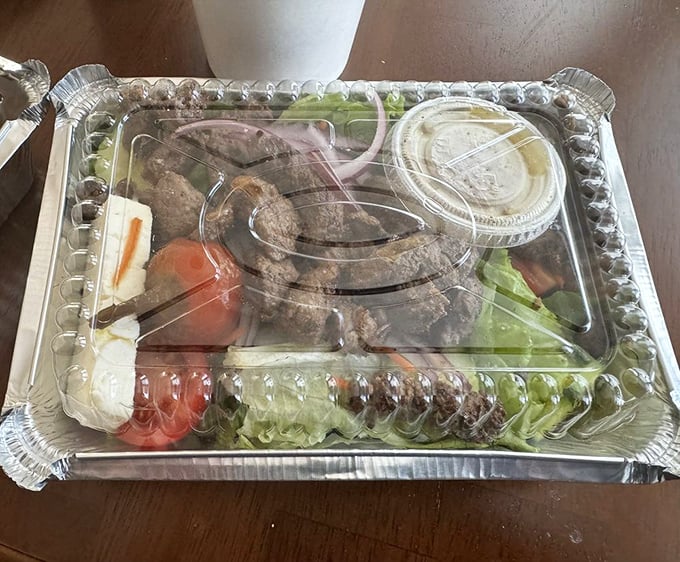 This steak salad doesn't know it's being served in a takeout container. It's dressed for a fine dining experience with those vibrant veggies and perfectly seared meat.