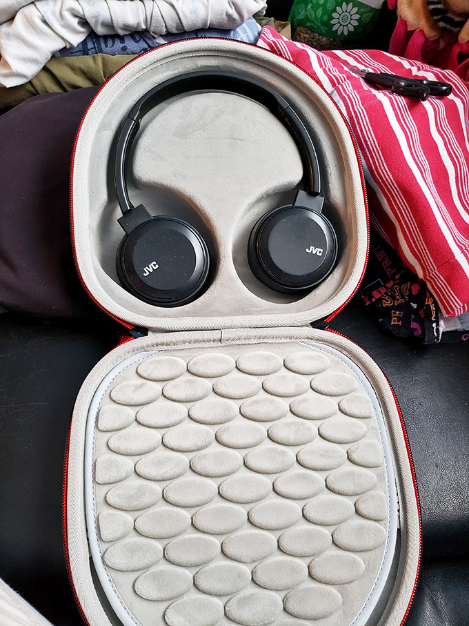 JVC headphones nestled in their case like sleeping technology waiting to be awakened. Someone's audio upgrade is just a purchase away.