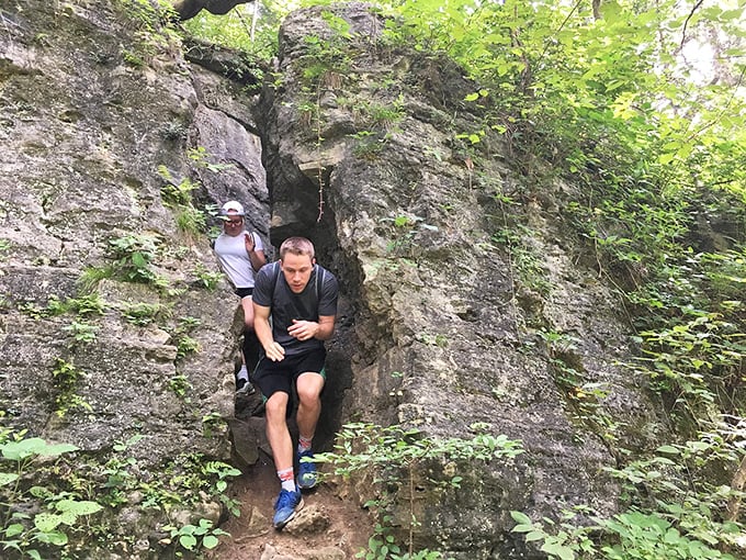 Adventure seekers squeeze through nature's doorway at Clifty Falls State Park, where hiking trails range from "pleasant stroll" to "what was I thinking?"