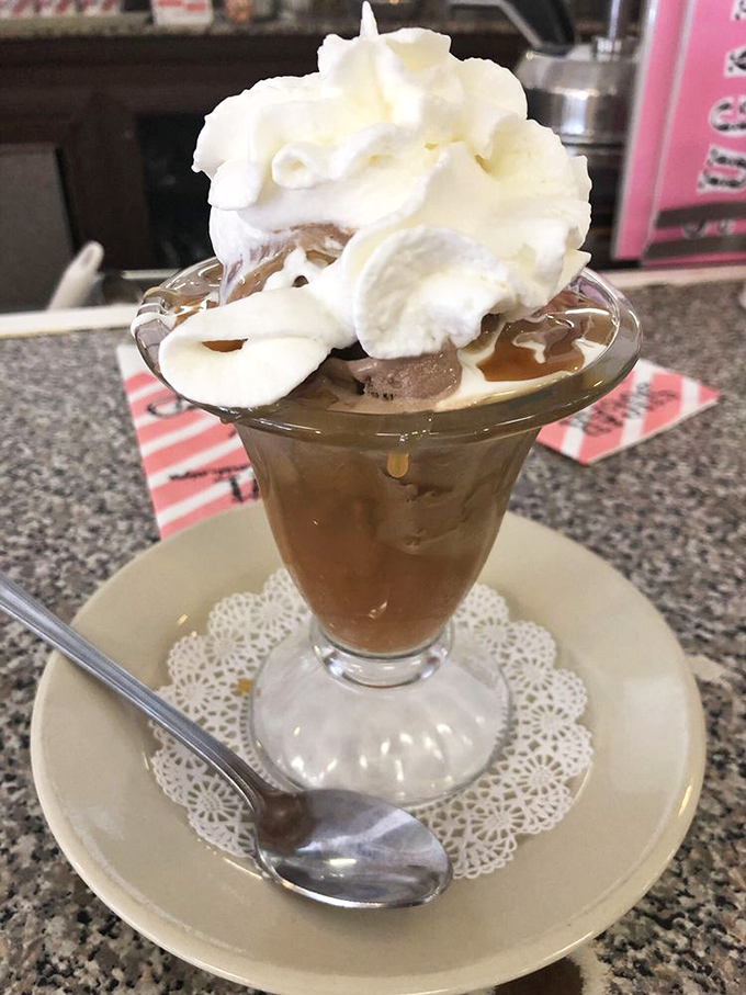 Caramel drips down scoops of ice cream like amber waterfalls, proving that sometimes the simplest combinations create the most profound pleasures.