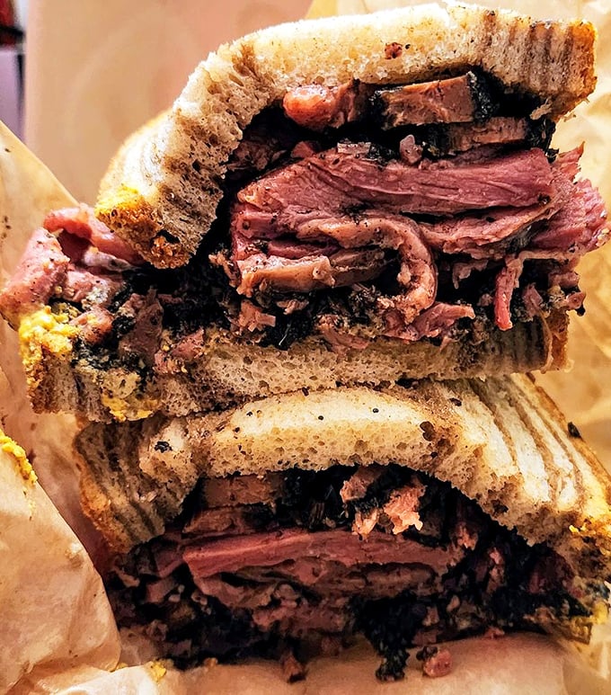 Behold the majesty of proper pastrami&mdash;each slice telling a story of patience, smoke, and spice in this towering monument to sandwich perfection.