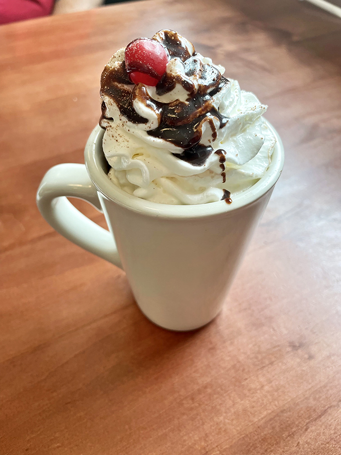 Not just hot chocolate&mdash;it's liquid dessert in a mug. That mountain of whipped cream topped with chocolate drizzle is practically begging for a selfie.